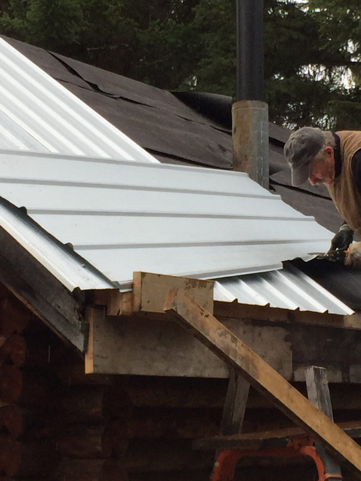 How to replace a roof - Installing a metal roof - Off Grid Cabin Living